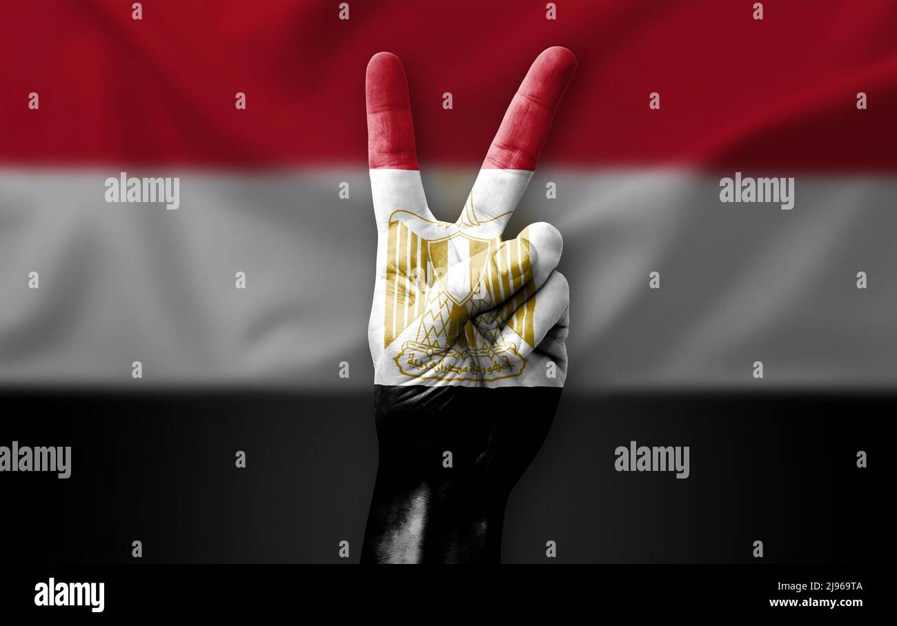 Hand making the V victory sign with flag of egypt Stock Photo - Alamy