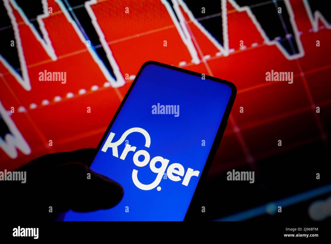 In this photo illustration, the Kroger Company logo seen displayed on a ...