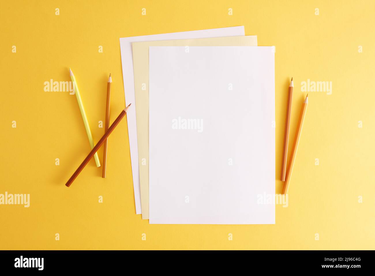 Colorful pencils and empty white papers . Empty place for text or ...