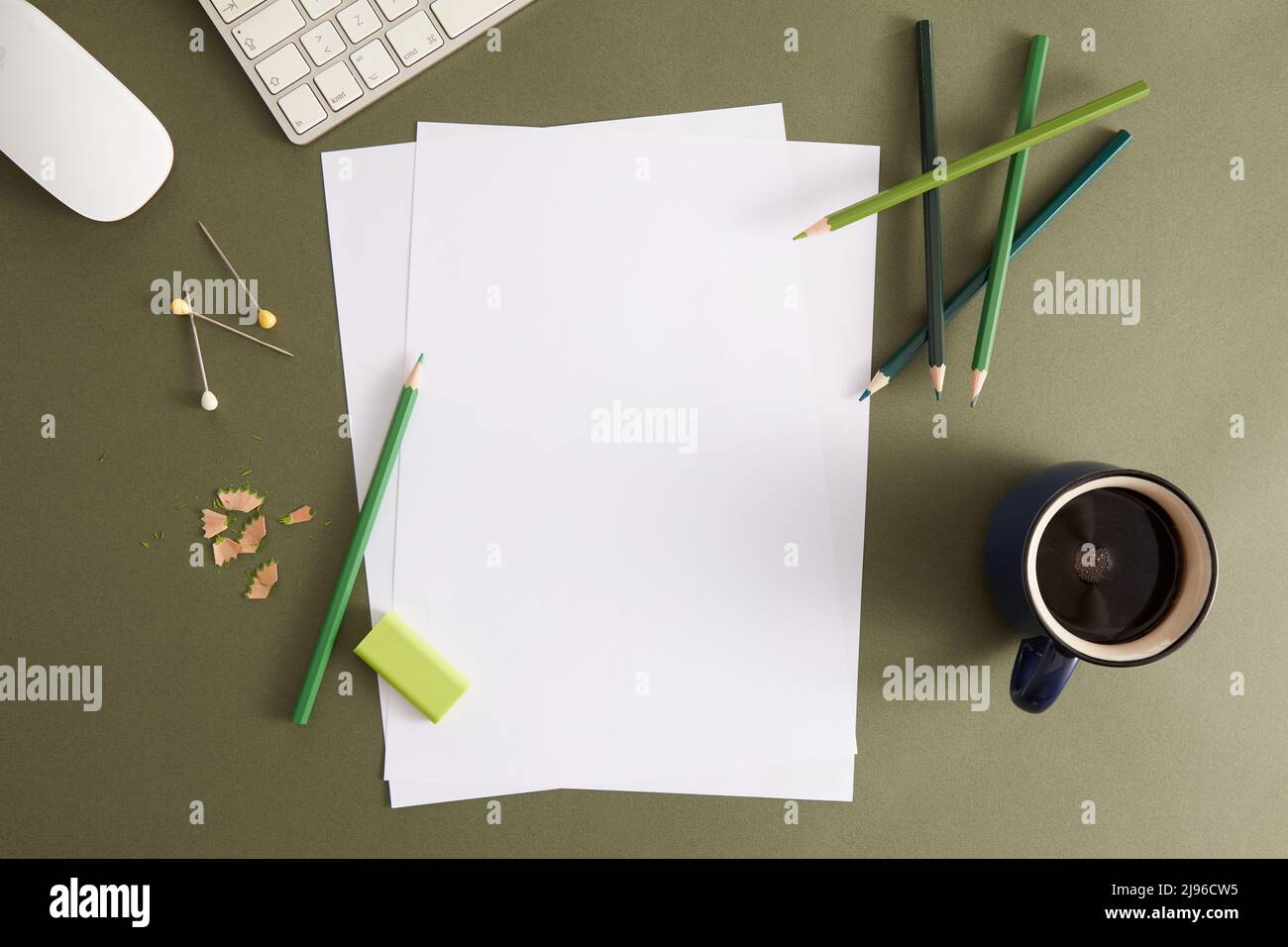 Green pencil, white paper and eraser. Empty place for text or drawing ...