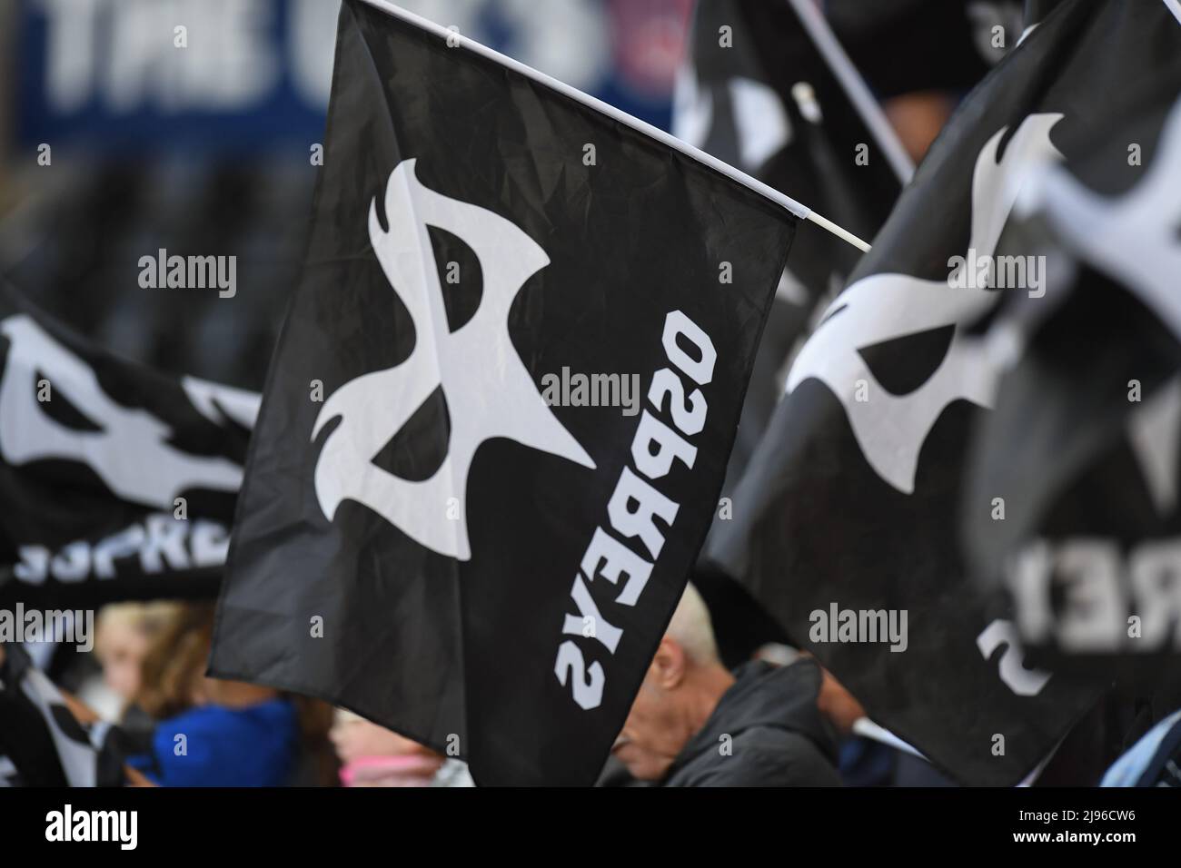 Supporters wave flags welcoming the teams onto the pitch Stock Photo ...