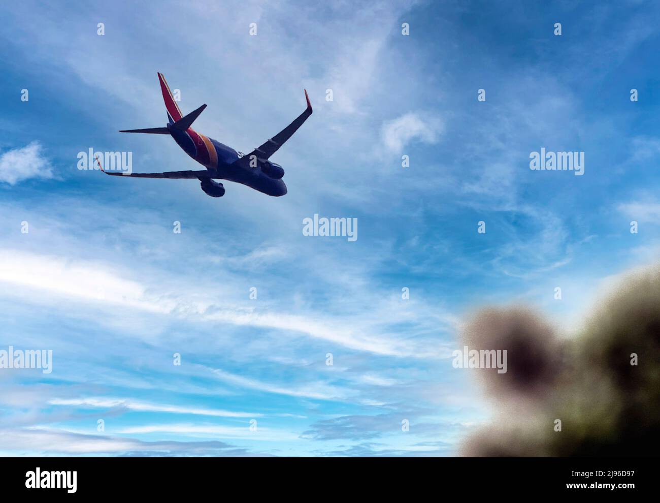 A Passenger jet flies overhead Stock Photo - Alamy