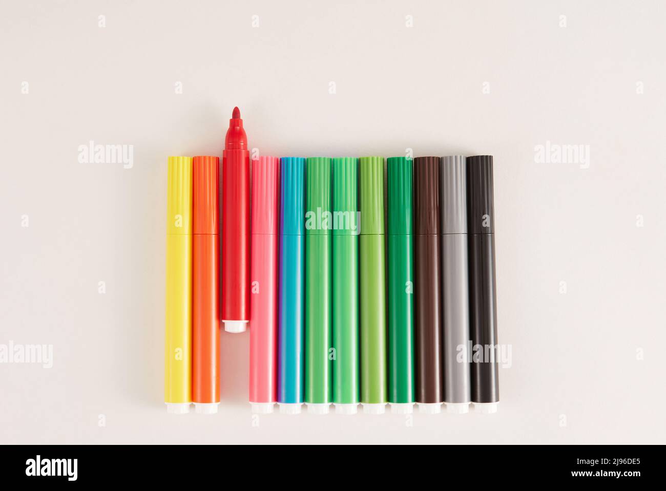 Colored markers on white background Stock Photo - Alamy