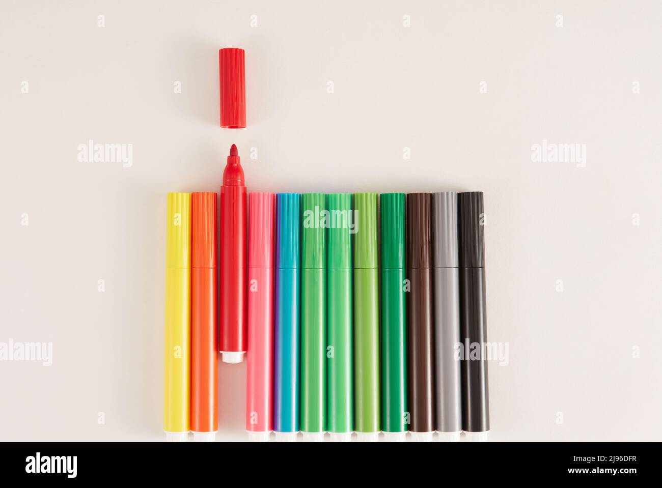 Colored markers on white background Stock Photo - Alamy