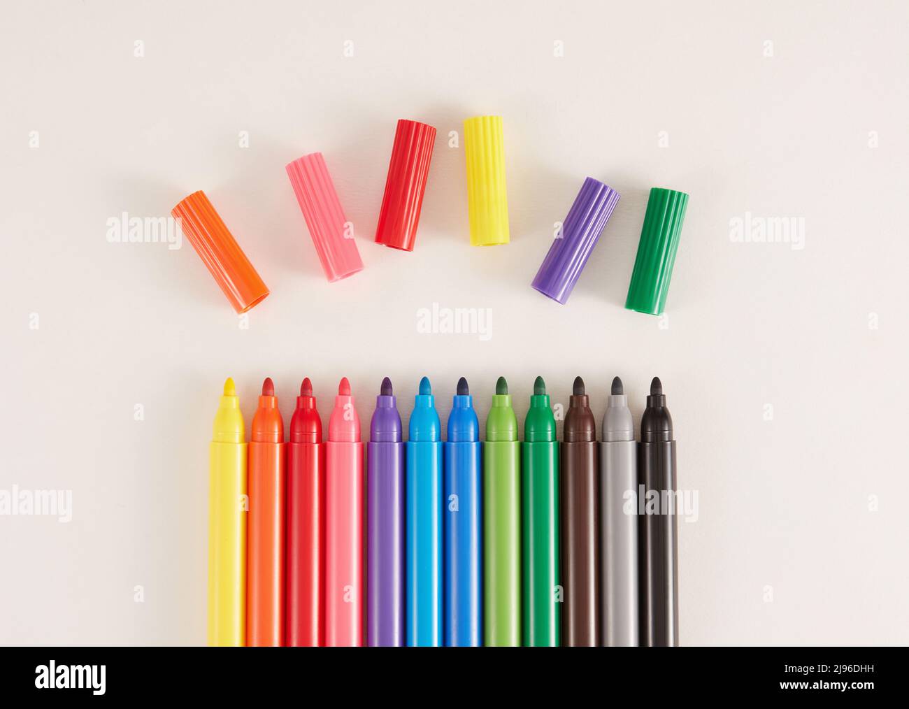 Colored markers on white background Stock Photo - Alamy
