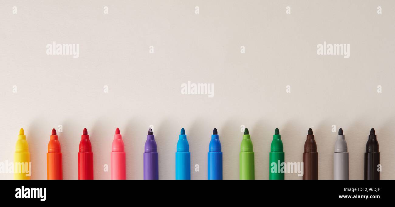 Colored markers on white background Stock Photo - Alamy