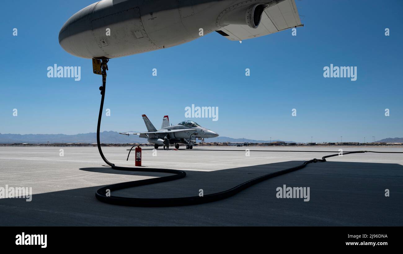 A U.S. Marine Corps (USMC) F/A-18C aircraft is refueled by a USMC KC ...