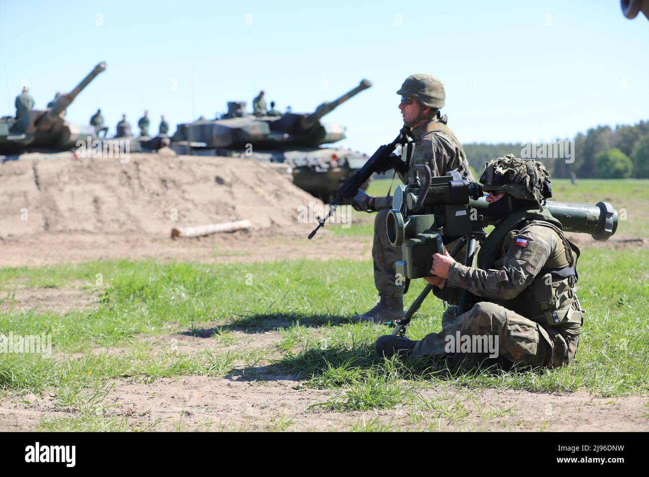 Two Polish soldiers ready an anti-armor weapon in preparation for the ...