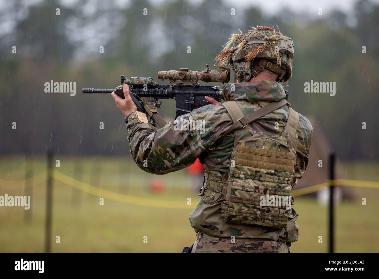 A U.S. Army Soldier prepares to suppress targets while his teammates ...