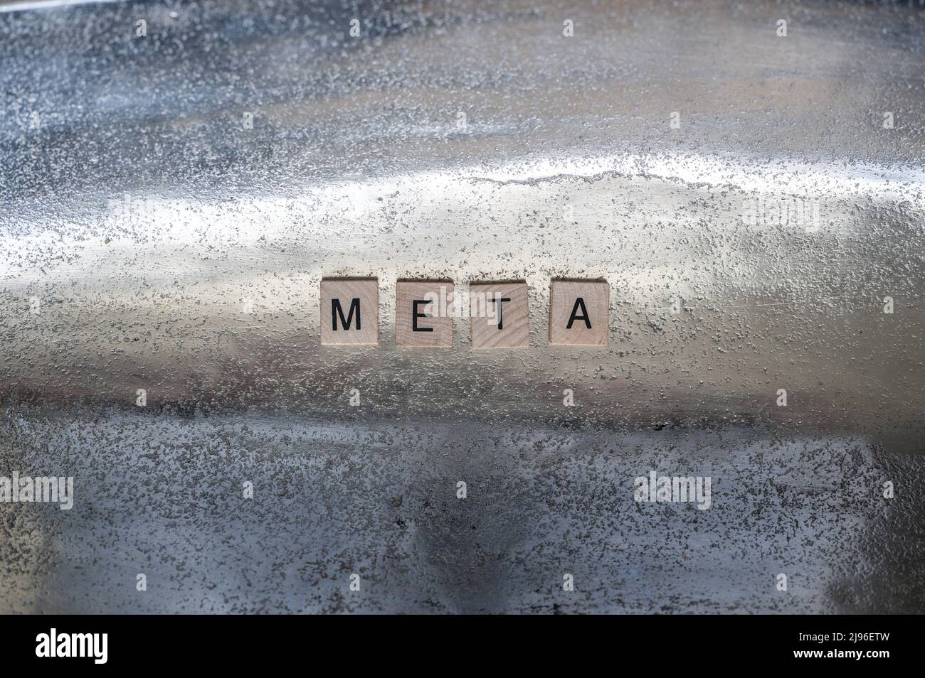 Meta concept with tile lettering and textured background Stock Photo ...