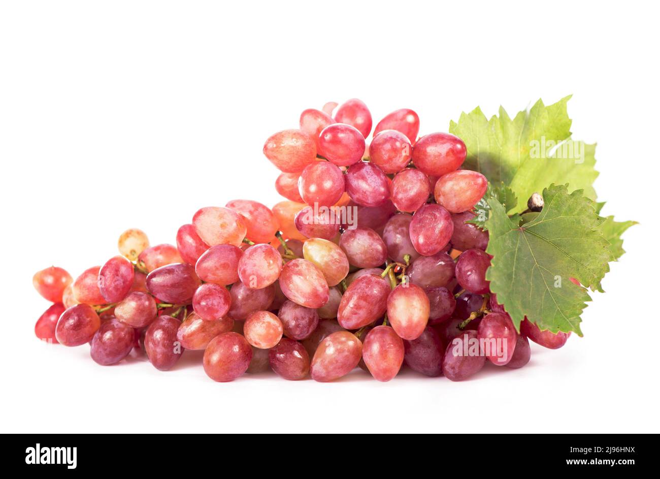 Ripe red grape with leaves isolated on white Stock Photo - Alamy