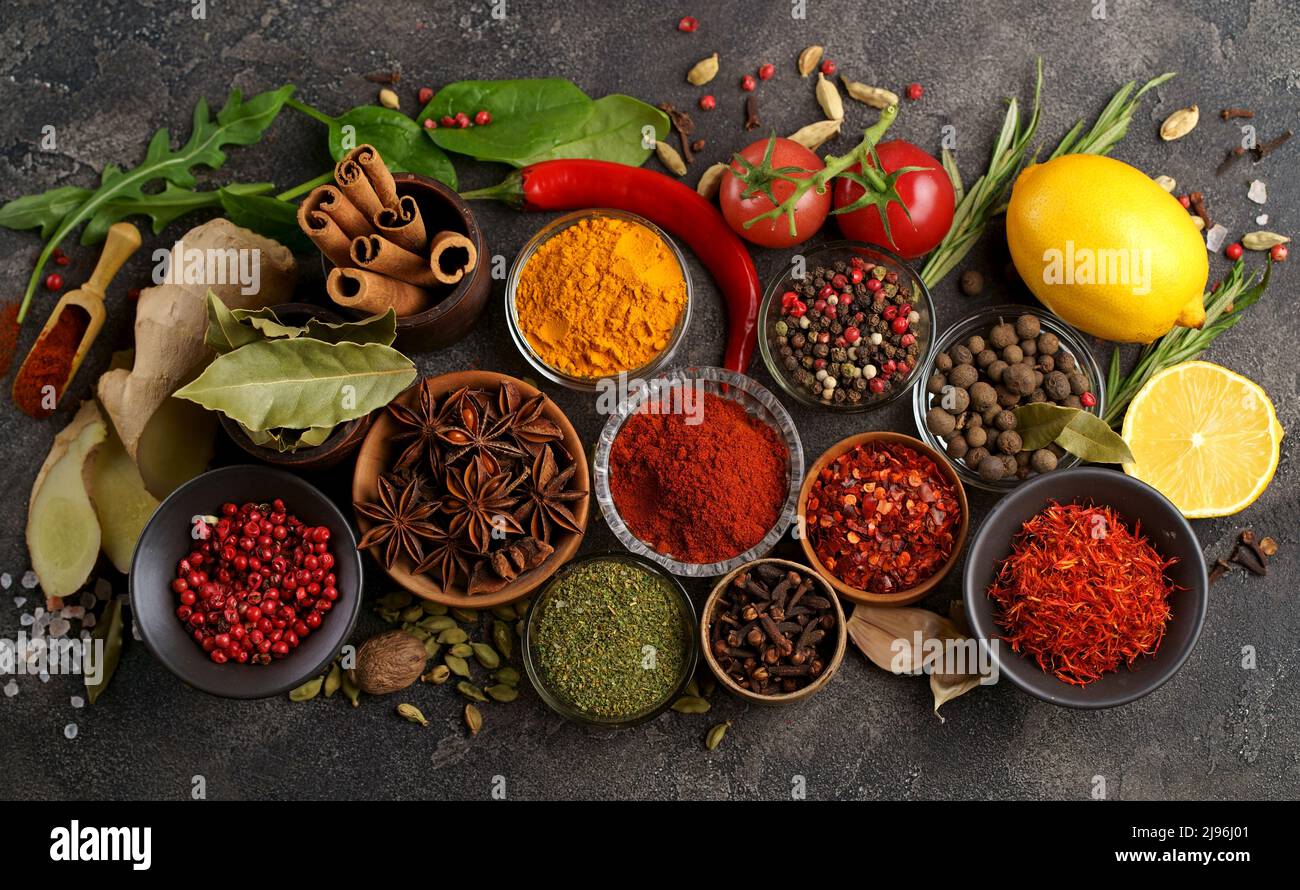 Assortment of natural spices on dark rustic stone background, Healthy ...
