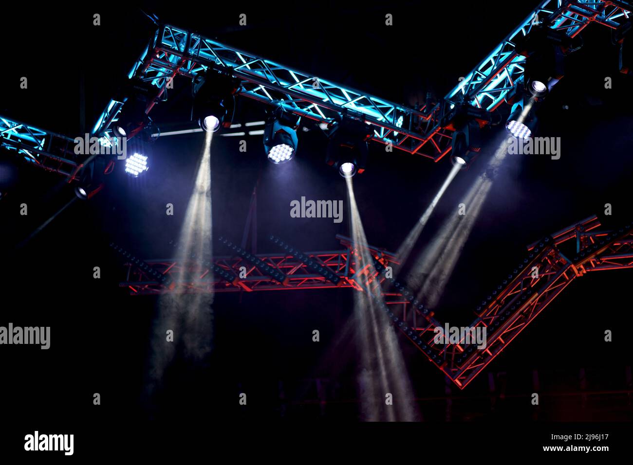 Crowd at concert - Cheering crowd in bright colorful stage lights Stock ...