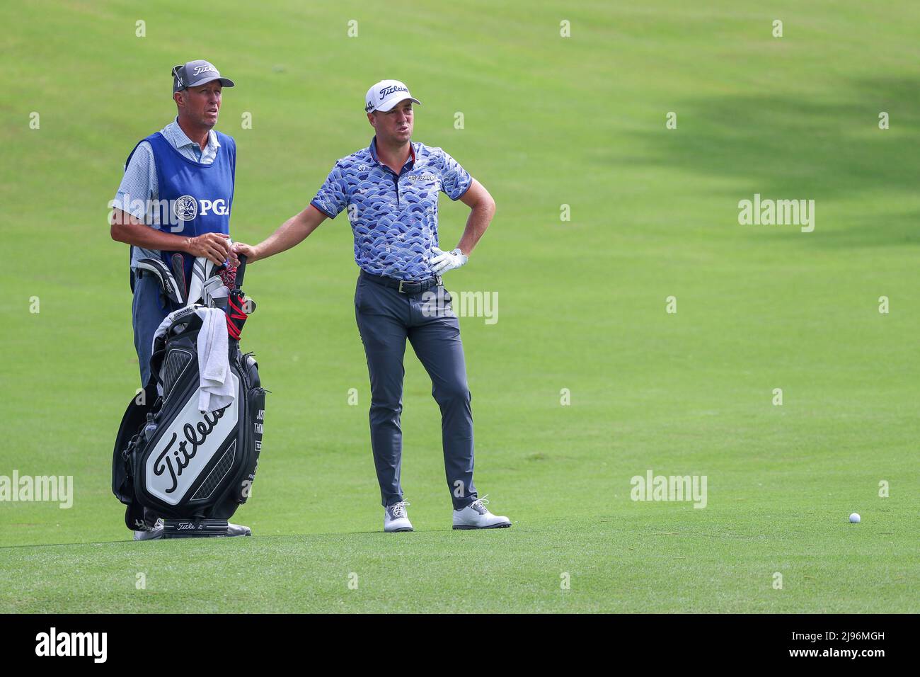 May 20, 2022: Justin Thomas and his caddy Jim 'Bones' Mackay size up an ...