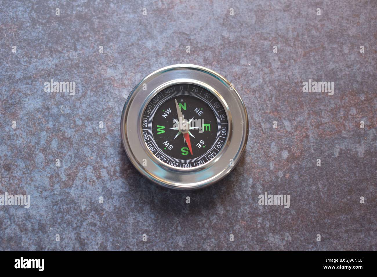 Metal round magnetic portable compass Stock Photo - Alamy