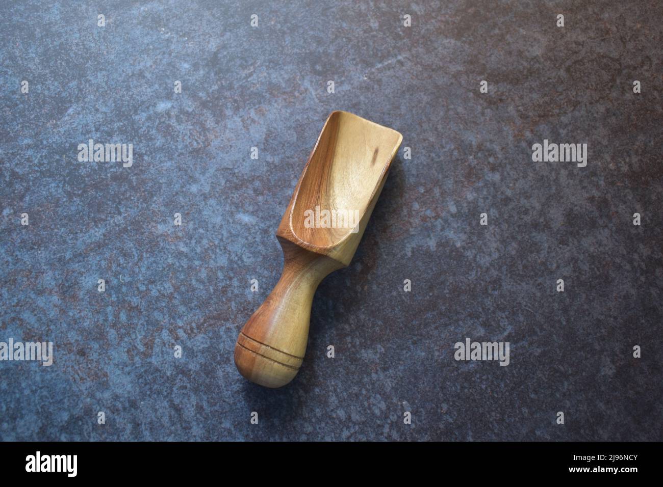 Empty wooden food grains measuring scoop Stock Photo - Alamy