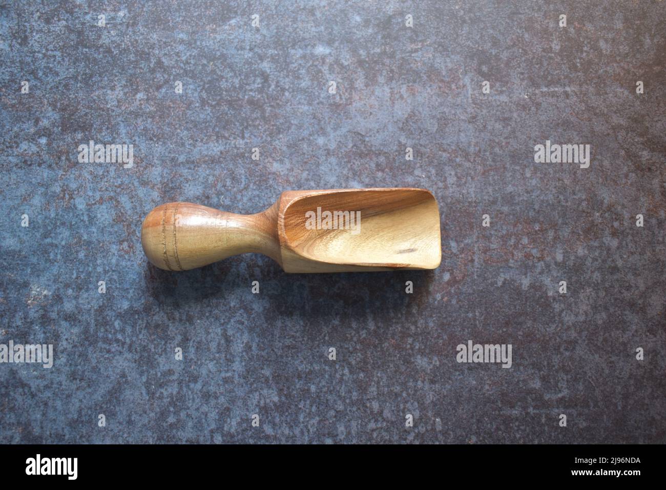 Empty wooden food grains measuring scoop Stock Photo - Alamy