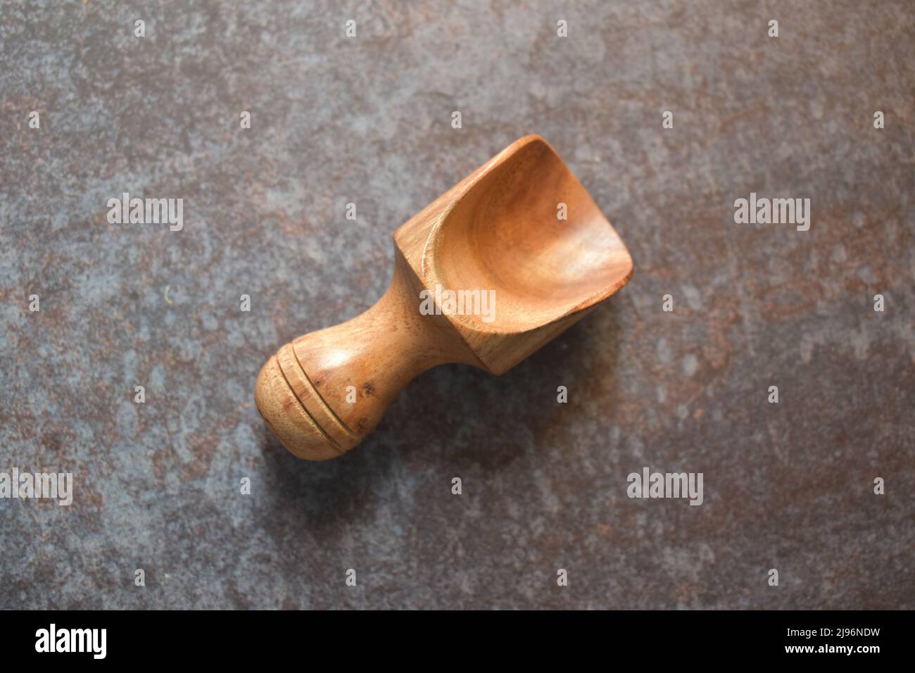 Empty wooden food grains measuring scoop Stock Photo - Alamy