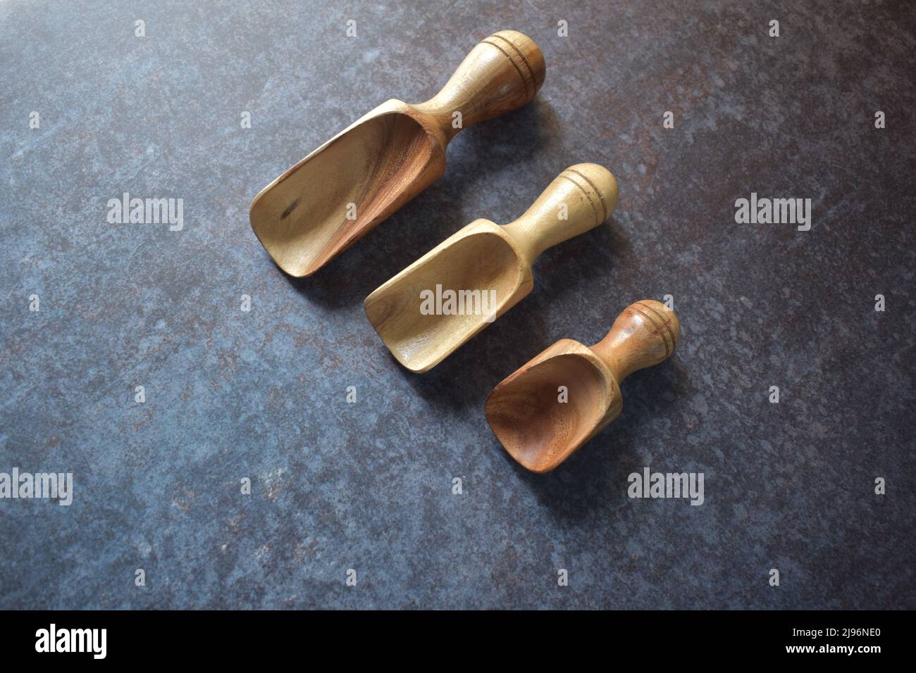 Empty wooden food grains measuring scoop Stock Photo - Alamy