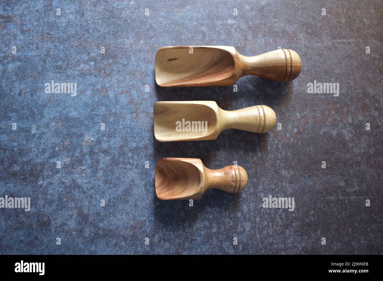 Empty wooden food grains measuring scoop Stock Photo - Alamy
