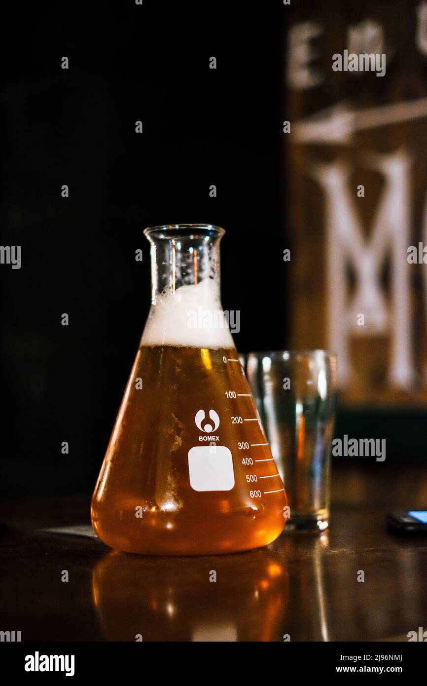 An erlenmeyer flask of beer Stock Photo - Alamy