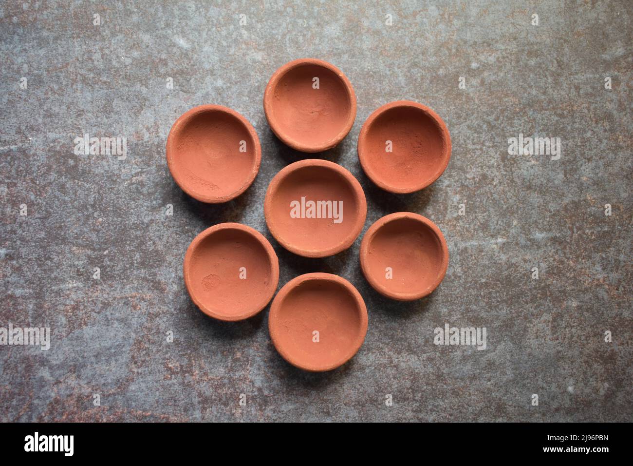 Red color earthen clay oil lamp Stock Photo - Alamy