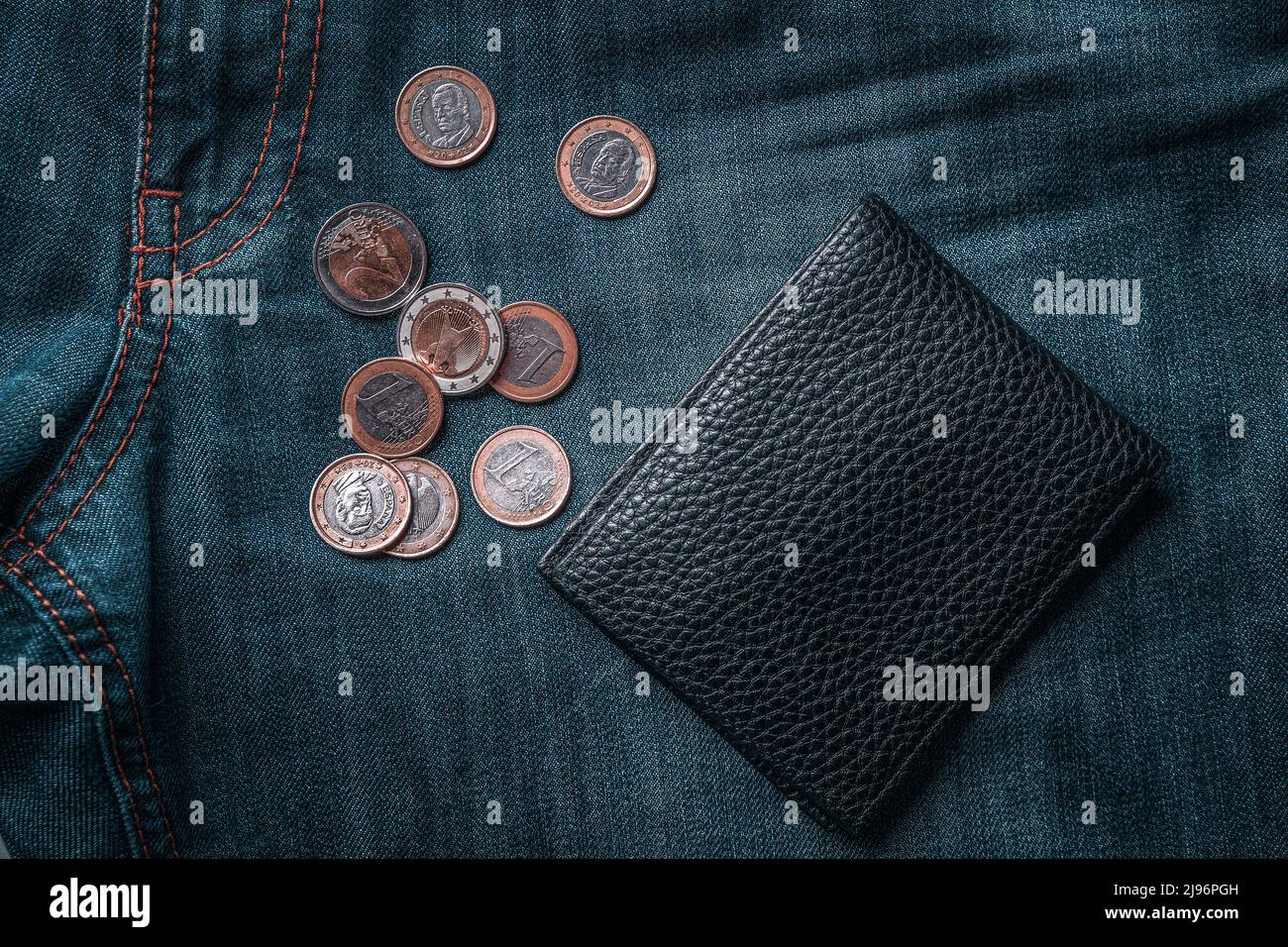 Empty black leather wallet and euro coins on jeans, top view Stock ...