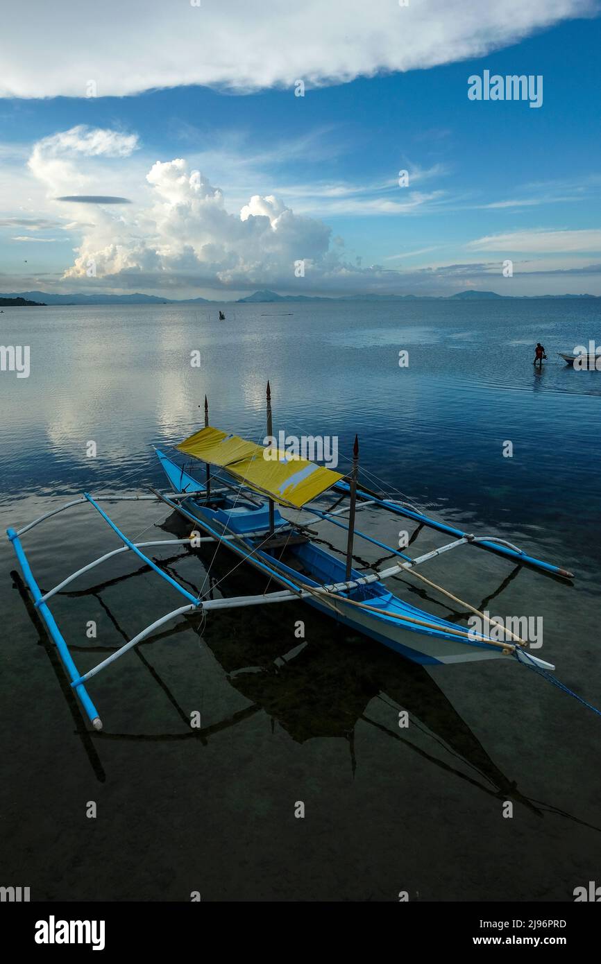 Taytay, Philippines - May 2022: Fishermen on a beach in Taytay on May ...