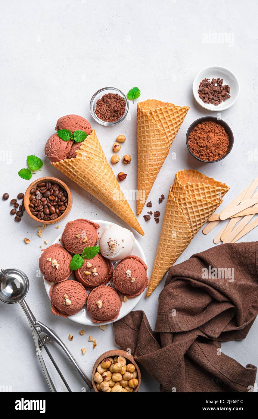 Ice cream, waffle cups and additives on a light background Stock Photo ...