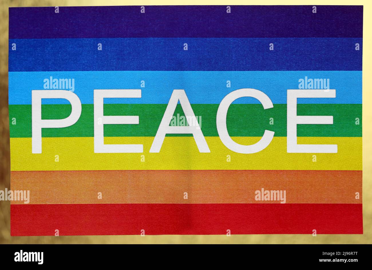 big flag with word peace on golden background symbol of hope for all ...