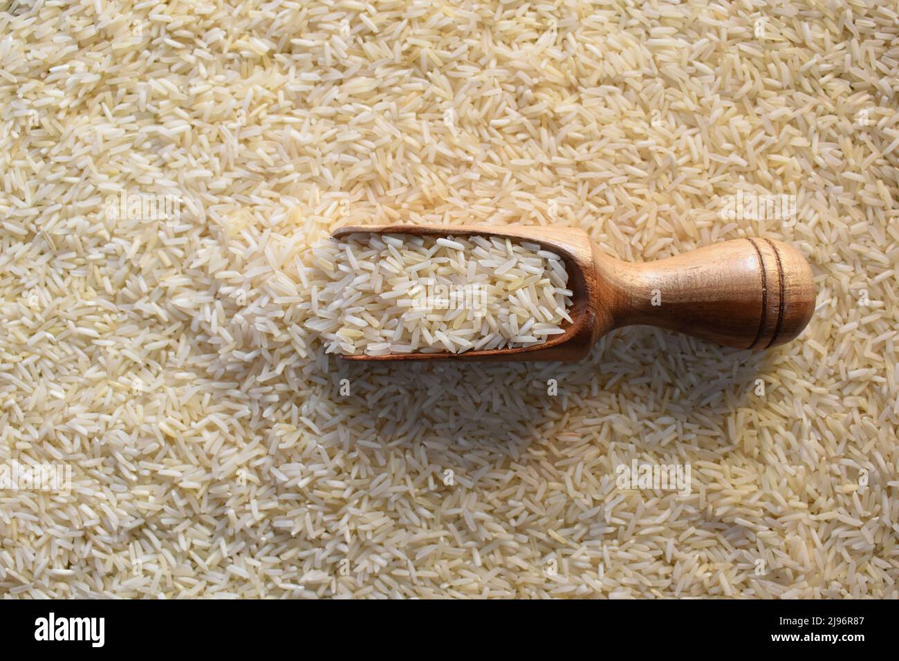 Raw whole dried Basmati rice Stock Photo - Alamy