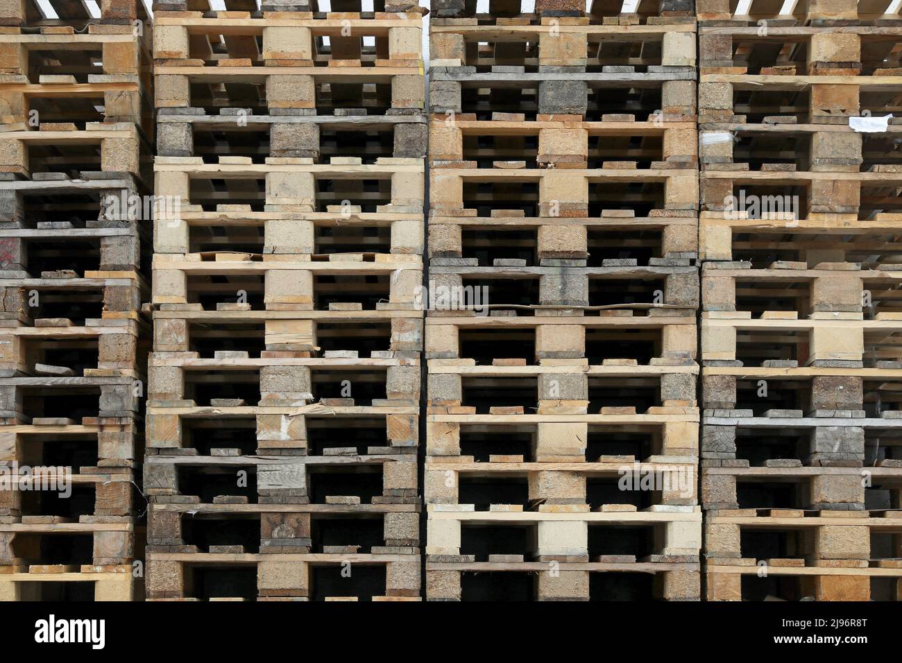 background of hundreds of wooden pallets in the warehouse of the ...
