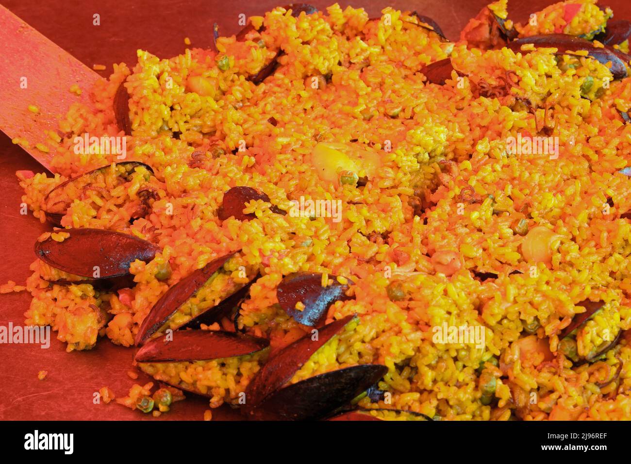 typical Spanish dish called PAELLA with risotto and seafood and mussels ...