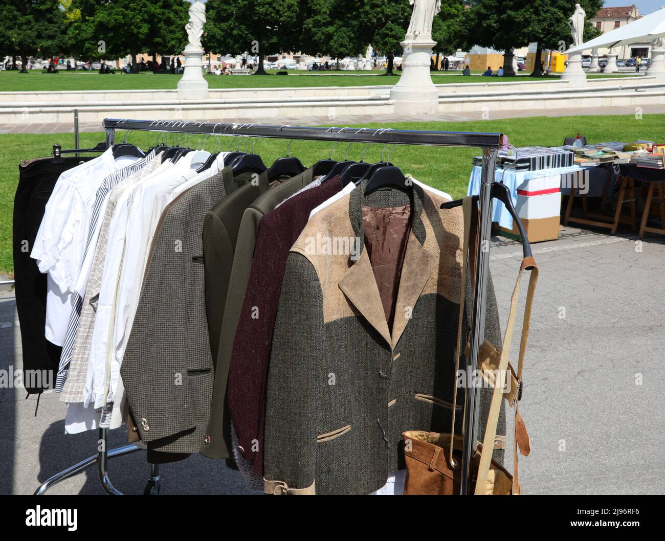 Alfresco flea market in the public park and the coats and jackets and ...