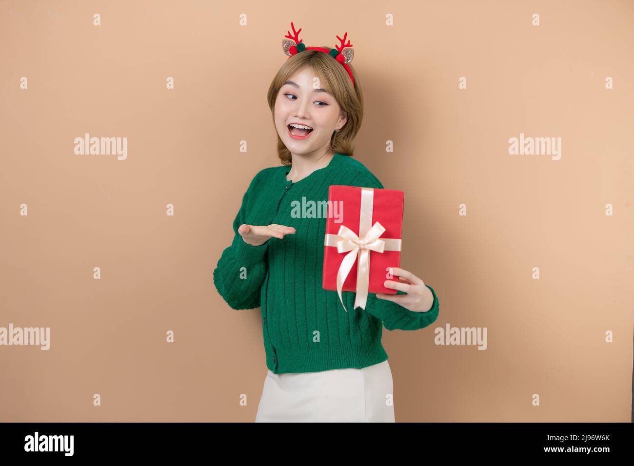 Photo of funny pretty lady hold big paper box with red box isolated on ...