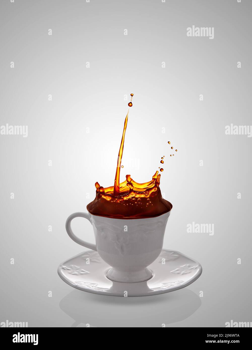 Coffee splash in white cup Stock Photo - Alamy