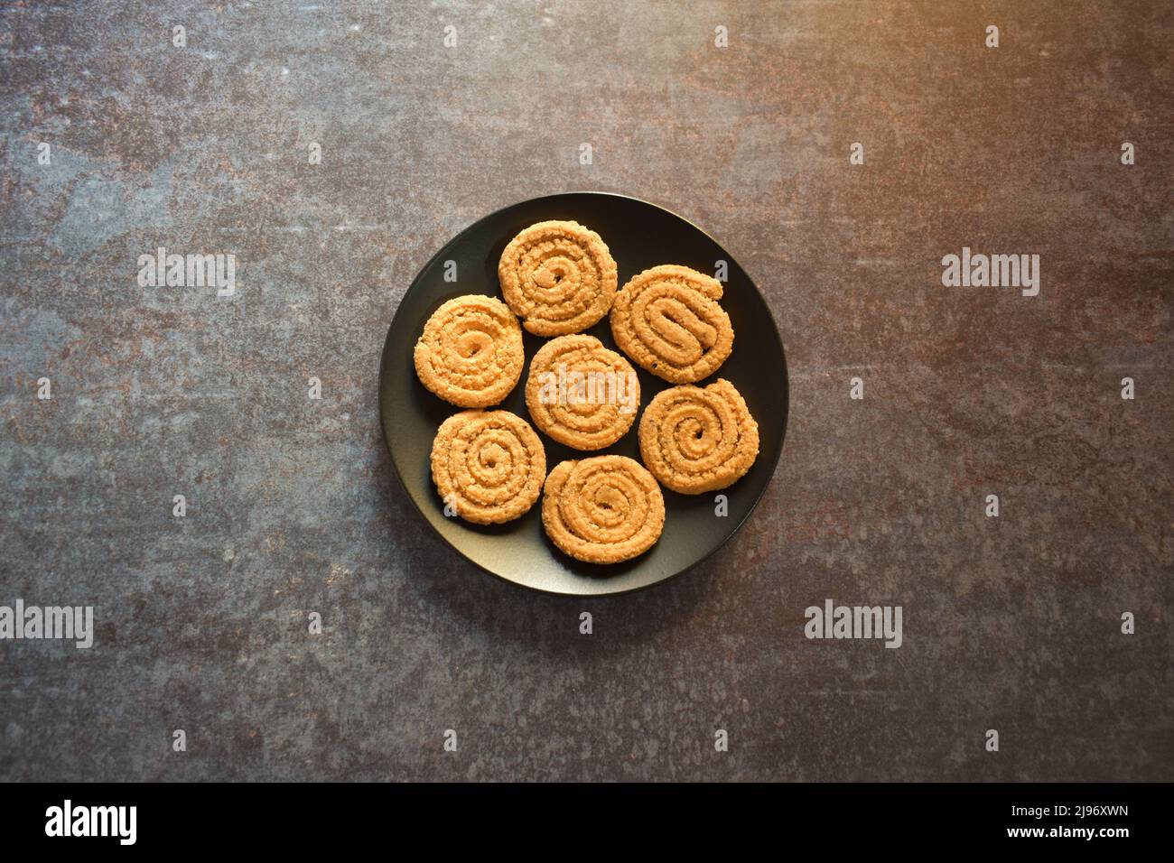 Chakli deep fried Indian traditional savory snack food Stock Photo - Alamy