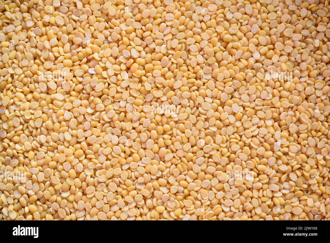 Raw yellow color dried split Mung lentils Stock Photo - Alamy