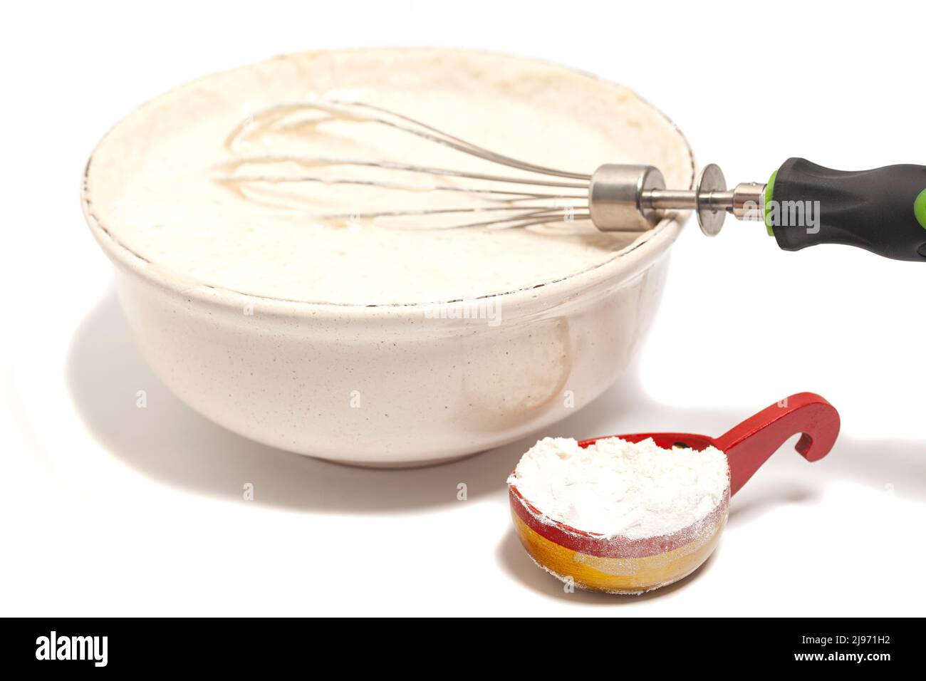 Mixing baking ingredients isolated on white background Stock Photo - Alamy