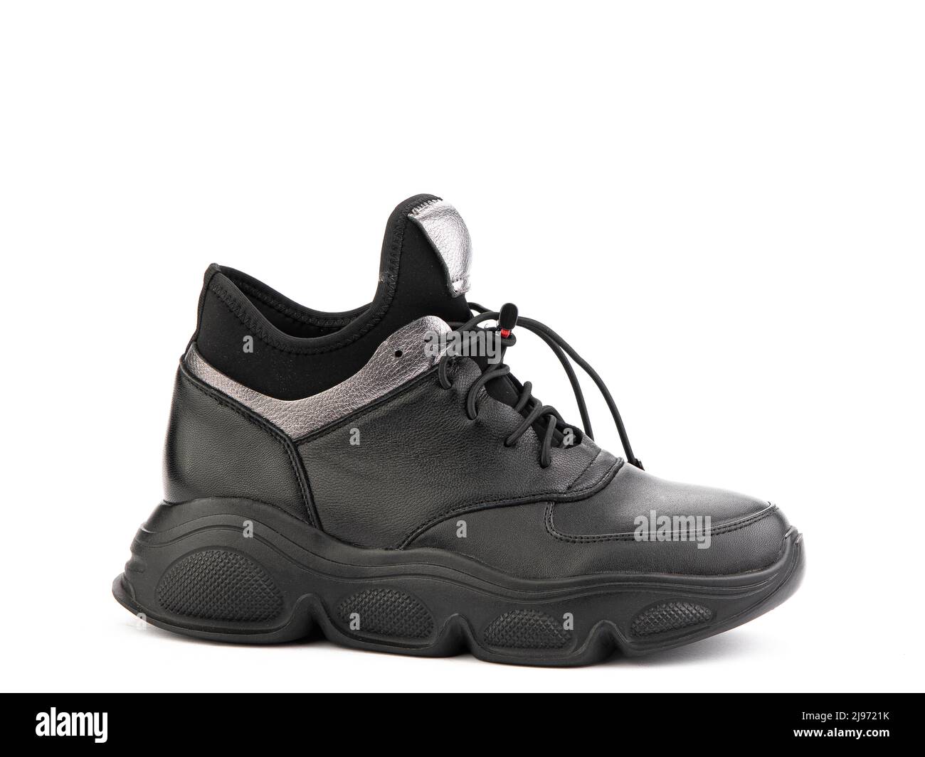 Silver and black leather sneakers. Casual women's style. Black rubber ...