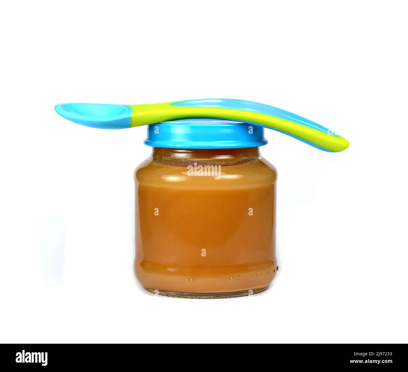 Baby fruit puree jar and spoon isolated on white Stock Photo - Alamy