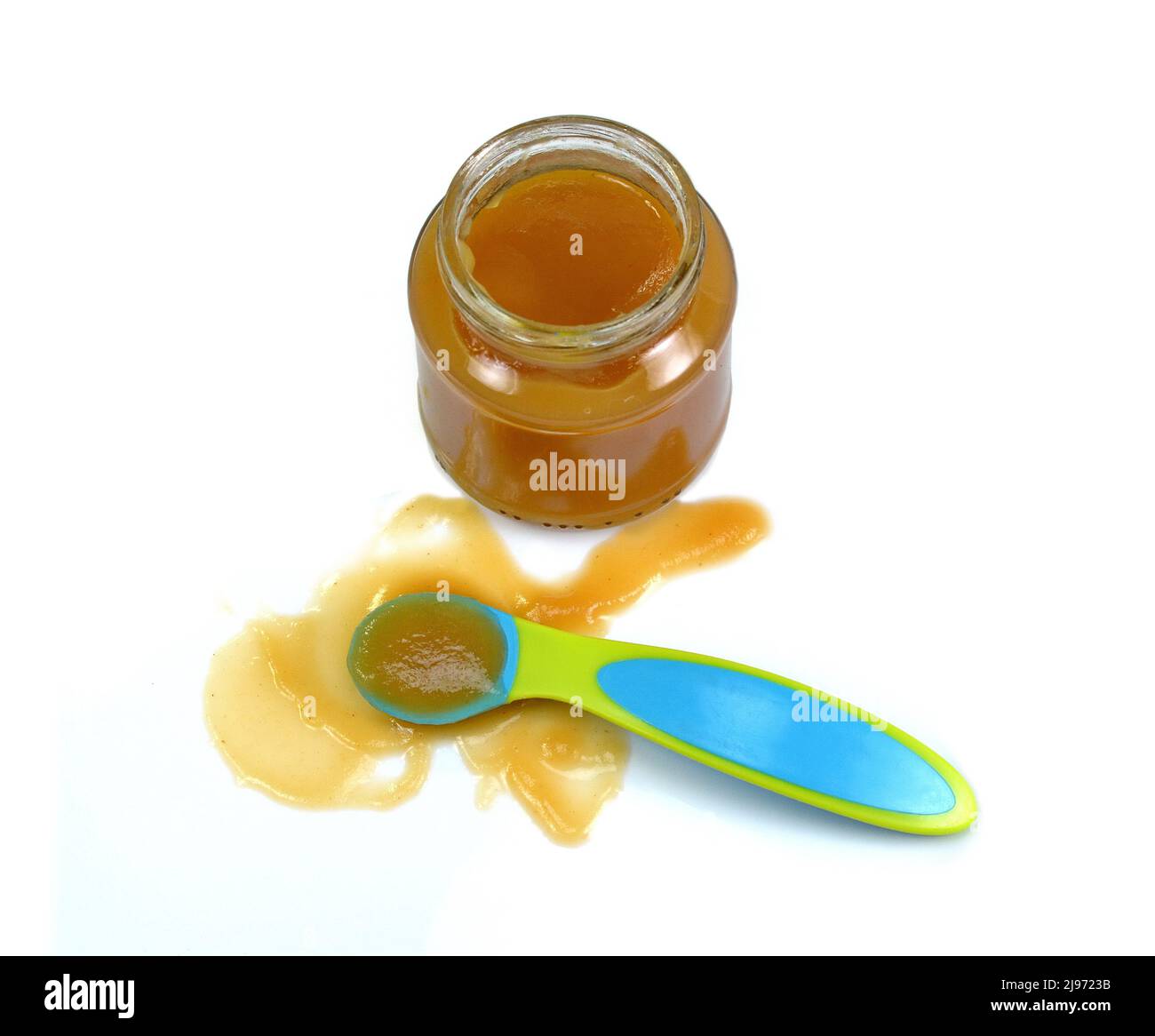 Baby fruit puree jar and spoon isolated on white Stock Photo - Alamy