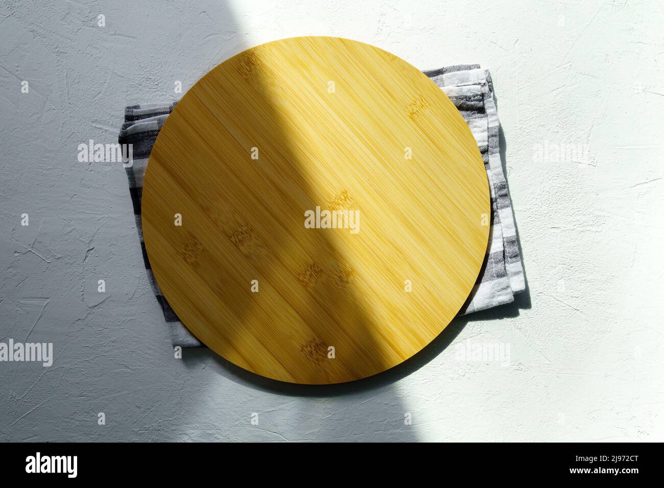 Cutting board on a light concrete background. Cooking backdrop. Top ...