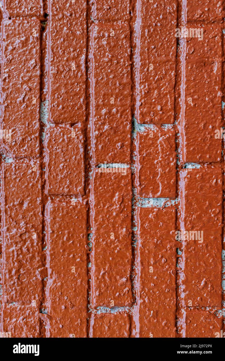 background in the form of brickwork with painted red paint. High ...
