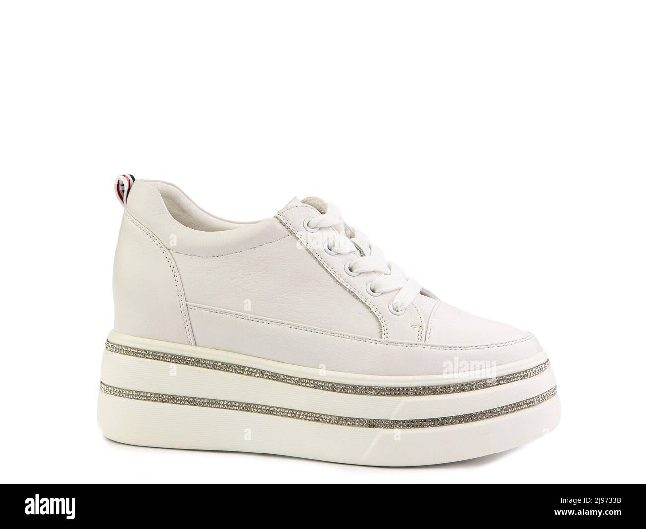 White classic leather trainers. Casual women's style. White lacing and ...