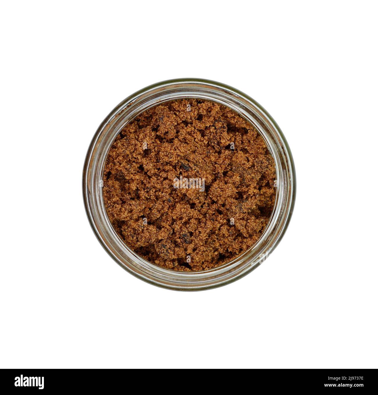 Raw Cane Sugar in a jar isolated on white background. Pile of dark ...