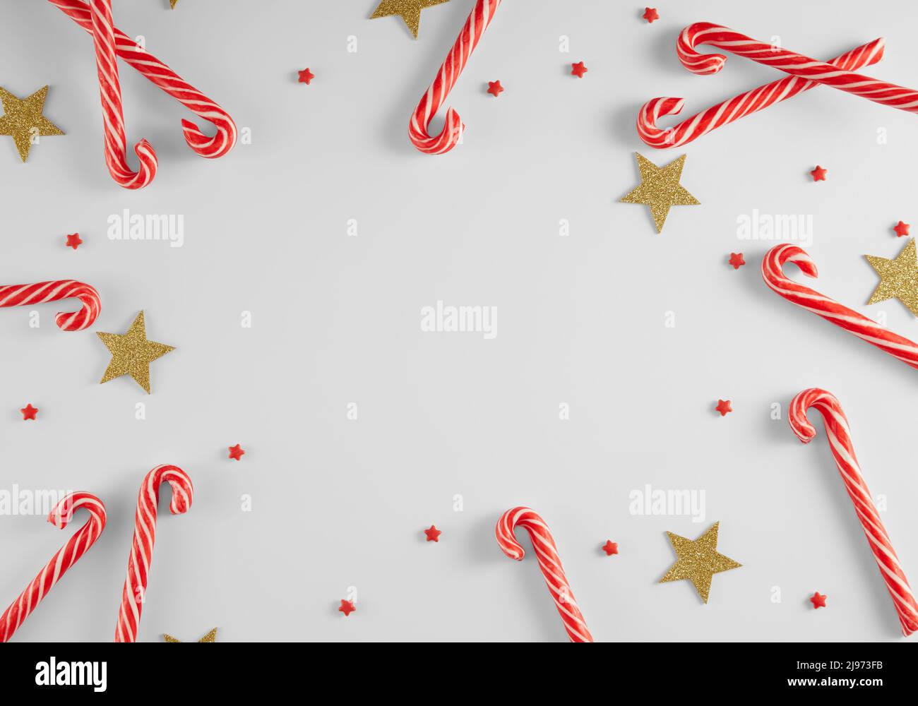 Candy cane on white background Stock Photo - Alamy