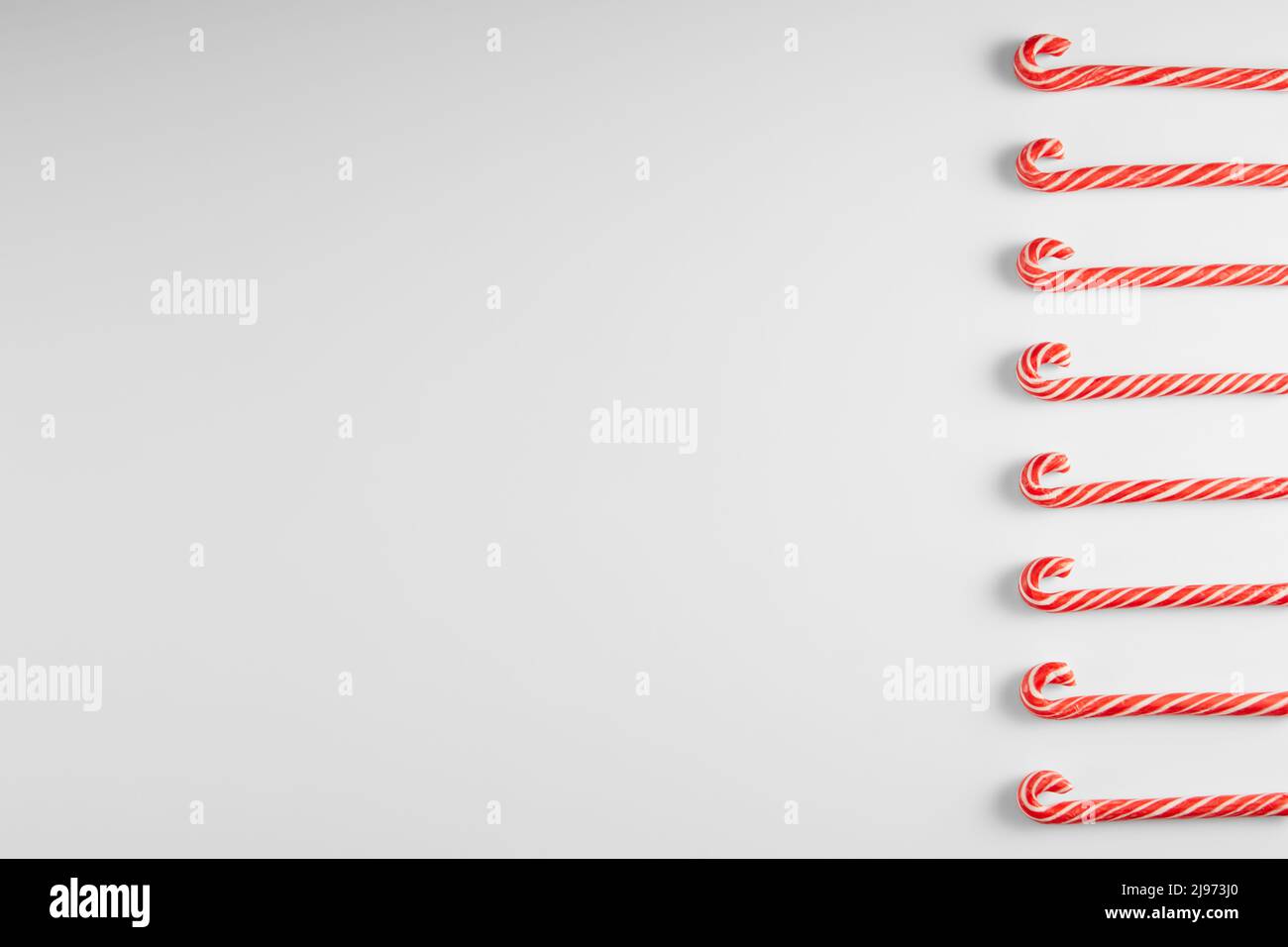 Candy cane on white background Stock Photo - Alamy