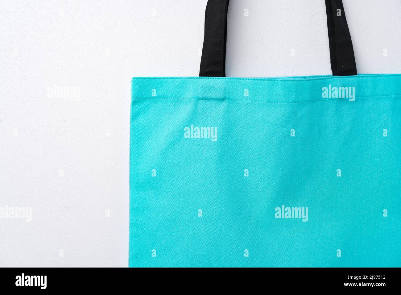 Empty fabric shopping bag on white background Stock Photo - Alamy