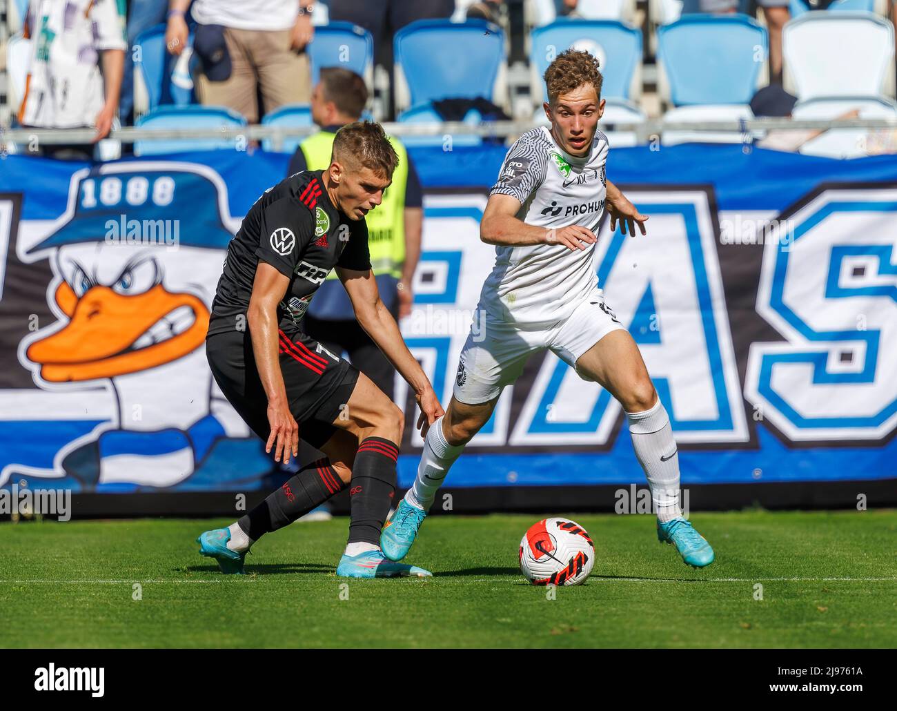 BUDAPEST, HUNGARY - MAY 15: Peter Barath of DVSC challenges Zalan ...